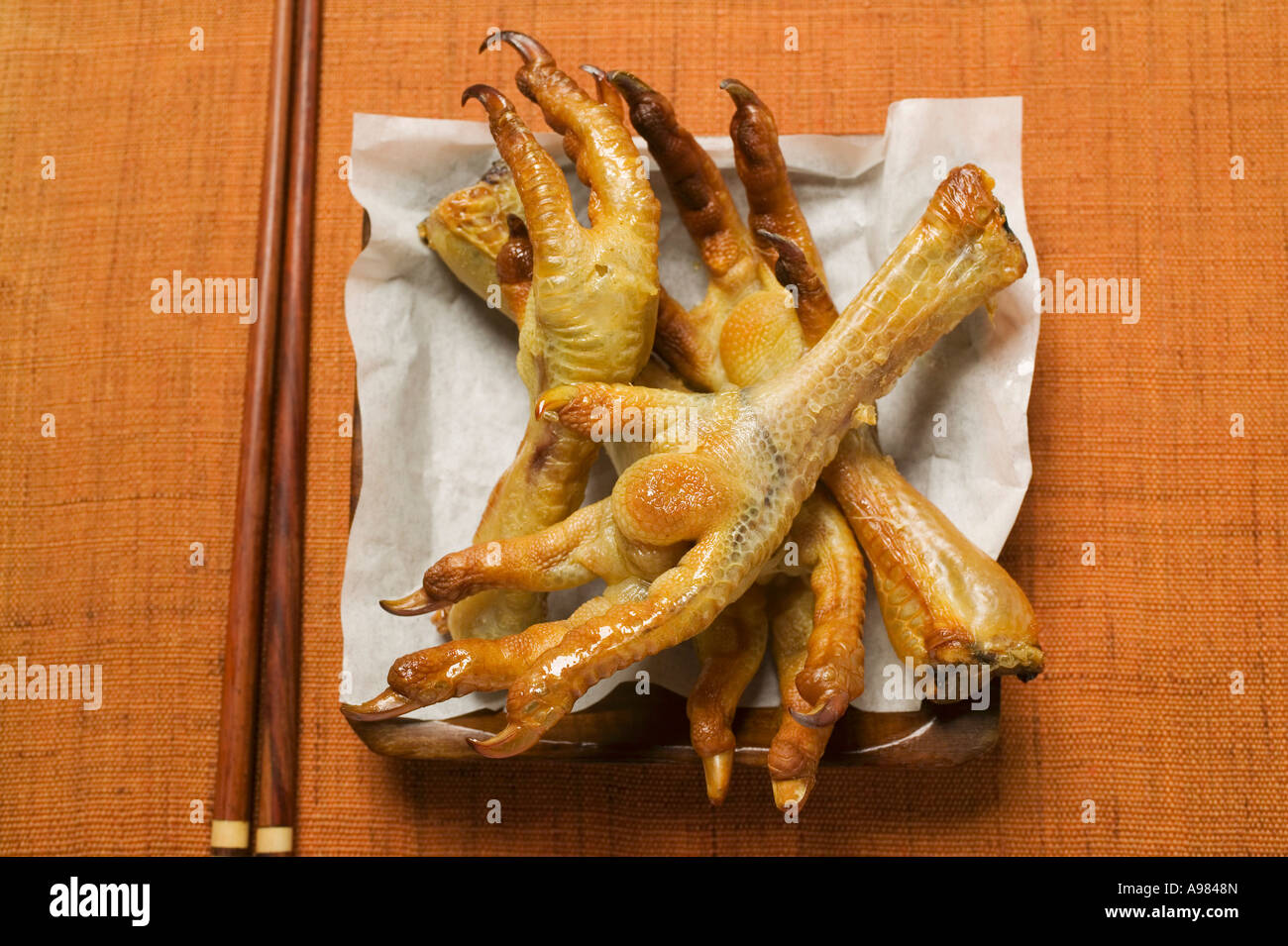 Deep fried chicken feet on paper Asia FoodCollection Stock Photo - Alamy