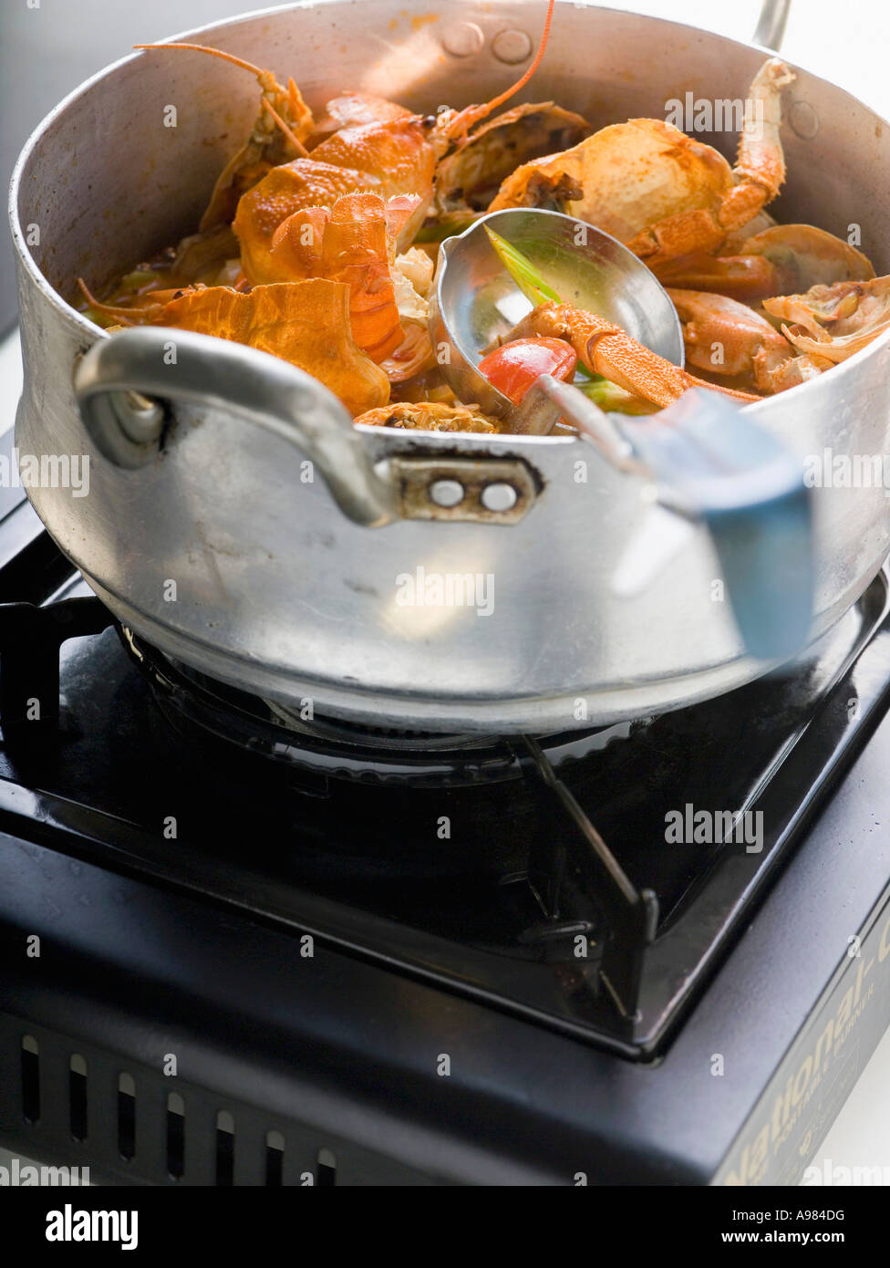 Crayfish stew in stew pan on cooker FoodCollection Stock Photo - Alamy