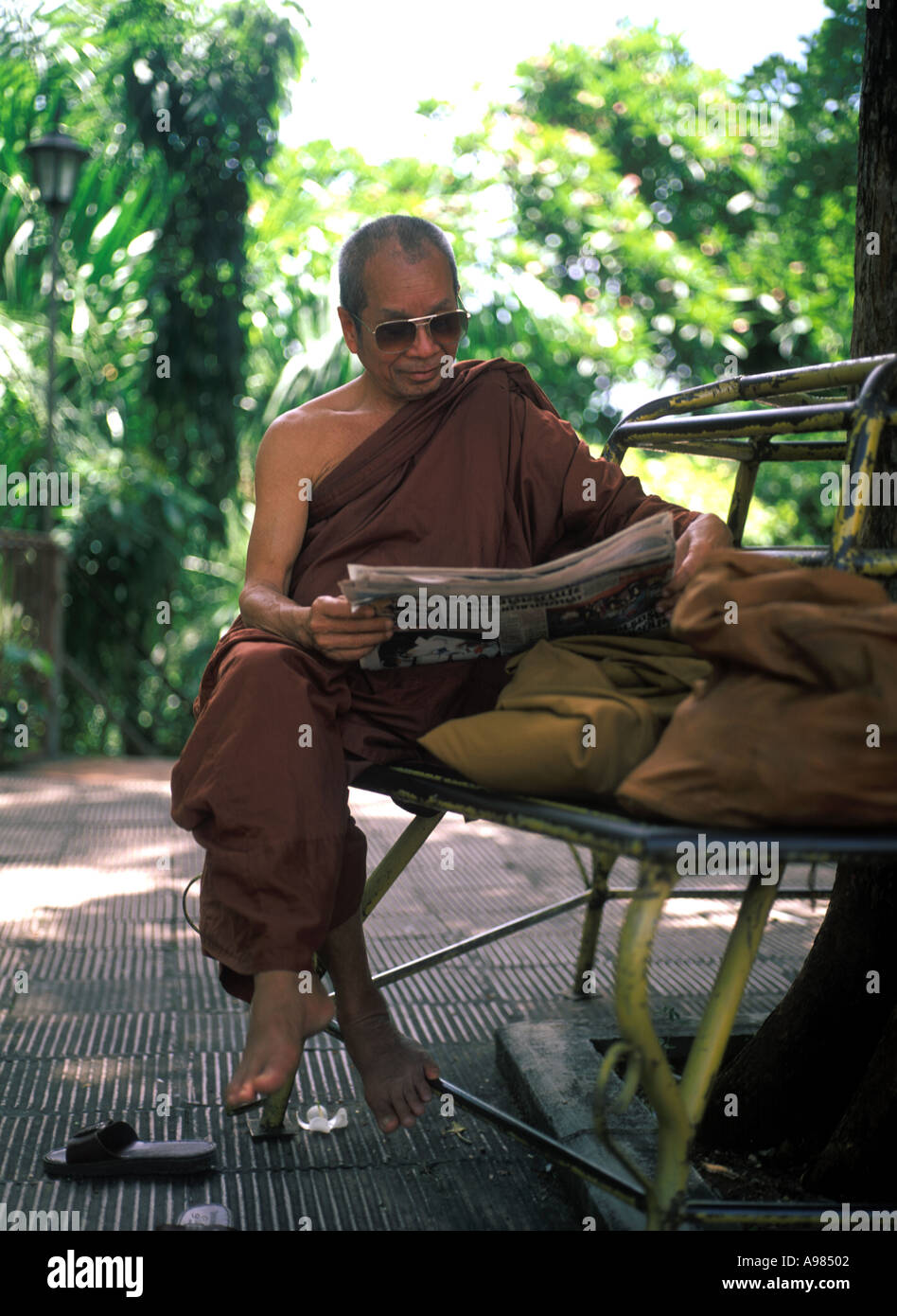 Buddhist monk reading news paper hi-res stock photography and images ...