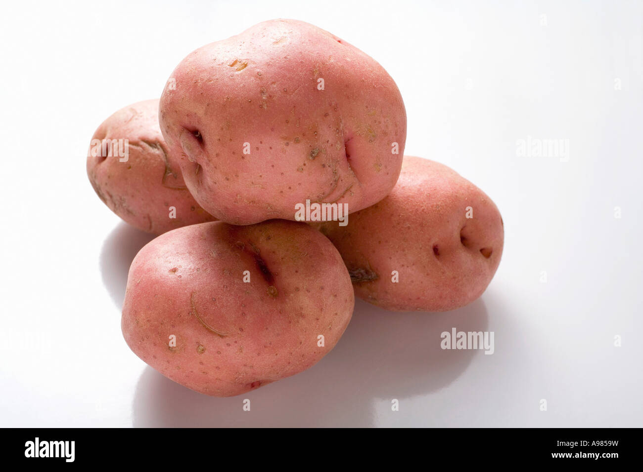 Four red potatoes FoodCollection Stock Photo - Alamy
