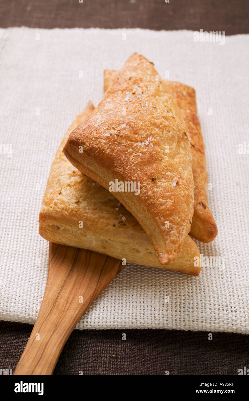 Triangular savoury puff pastry pasties on server FoodCollection Stock ...