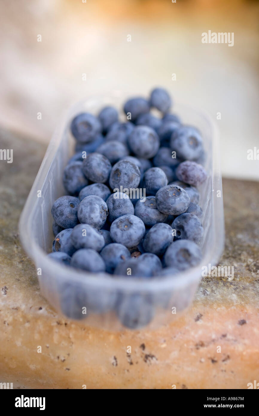 Blueberries in plastic punnet on a stone sink FoodCollection Stock ...