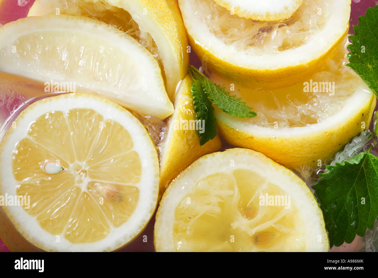 Squeezed lemons in water in glass bowl close up FoodCollection Stock ...