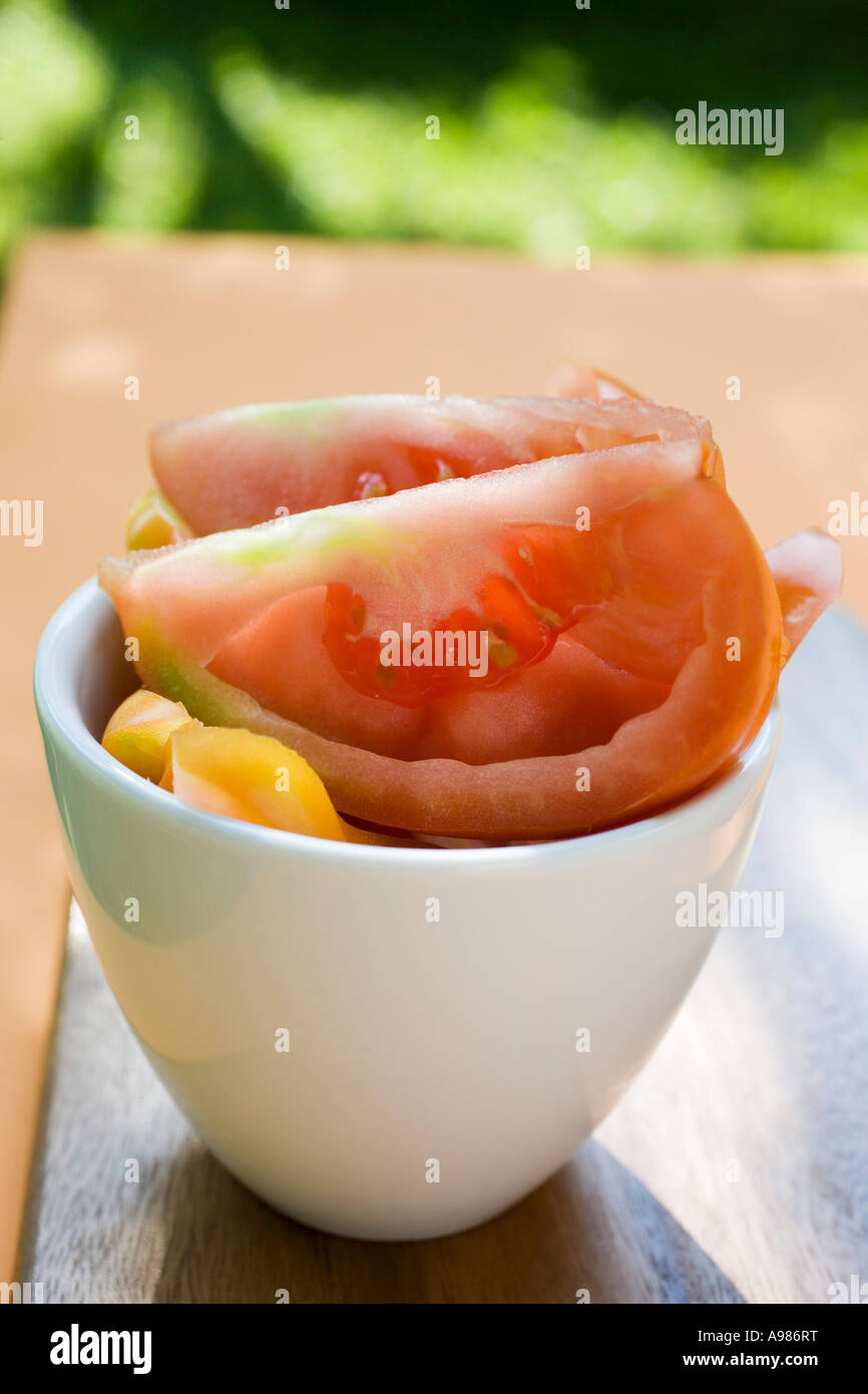 Tomato wedges in white bowl FoodCollection Stock Photo - Alamy
