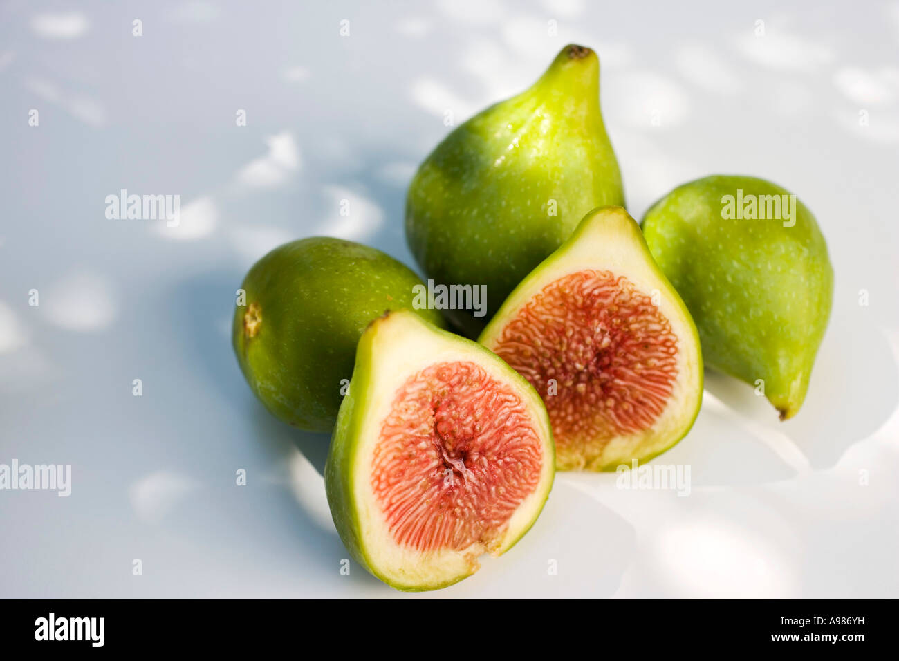 Three whole figs and two fig halves FoodCollection Stock Photo - Alamy