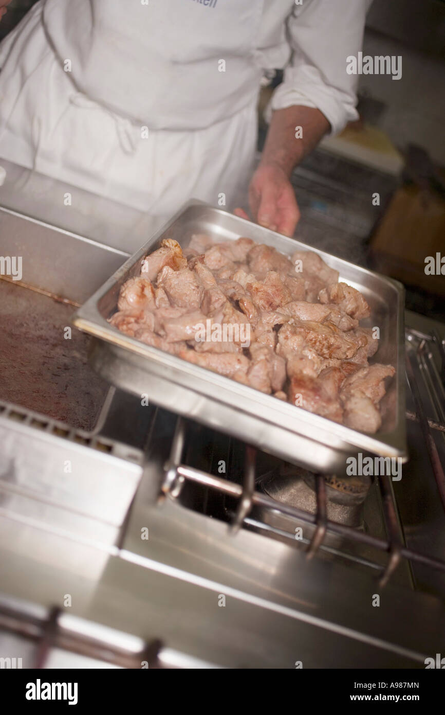 Raost pork in roasting tin chef in background FoodCollection Stock ...