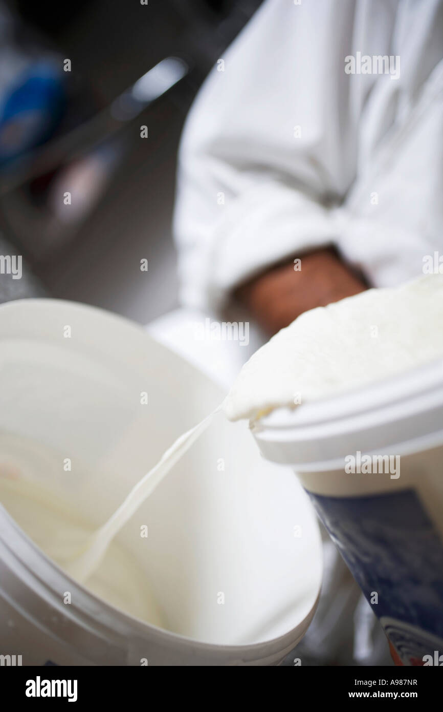 Pouring cream into tub FoodCollection Stock Photo - Alamy