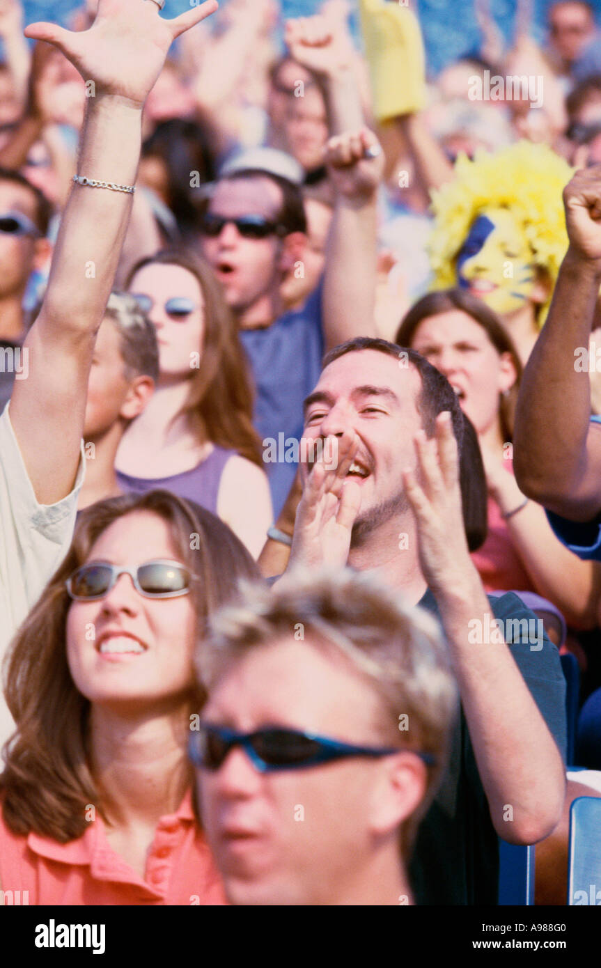 Group of spectators cheering in a stadium Stock Photo - Alamy