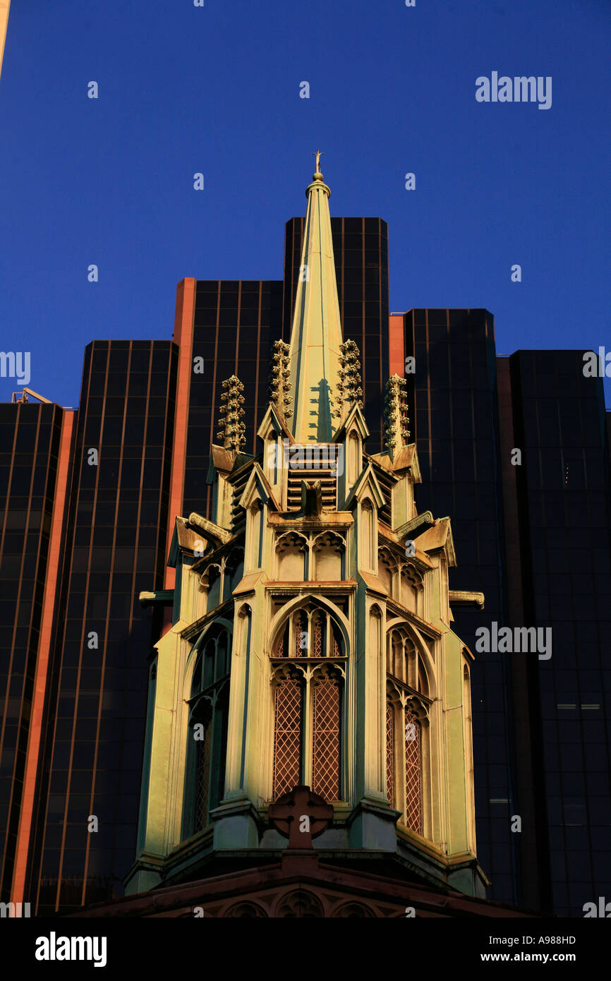 Old Christian architecture is overshadowed by modern capitalist ...