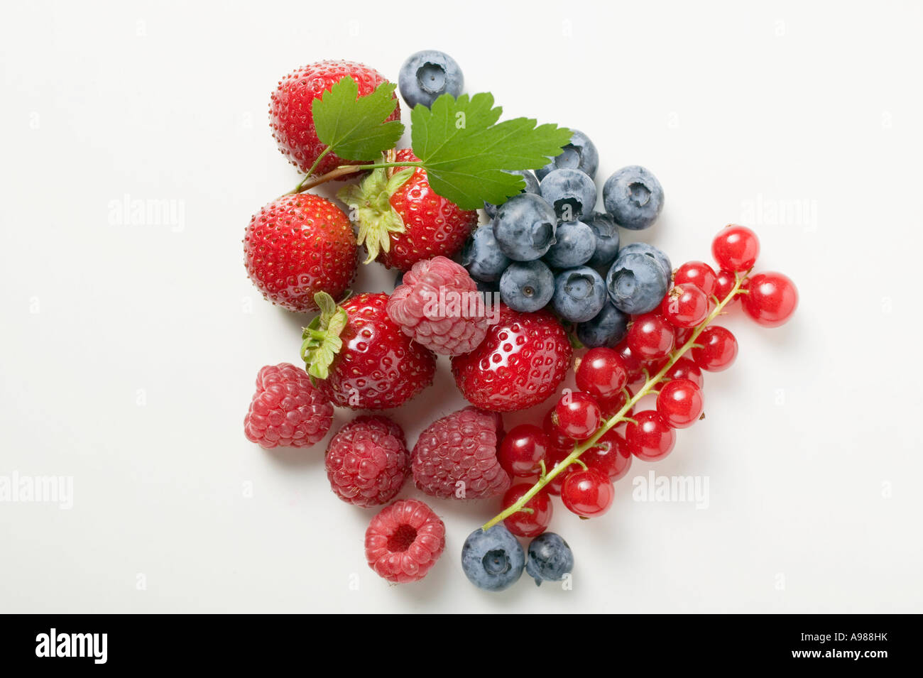 Assorted berries with leaves FoodCollection Stock Photo - Alamy