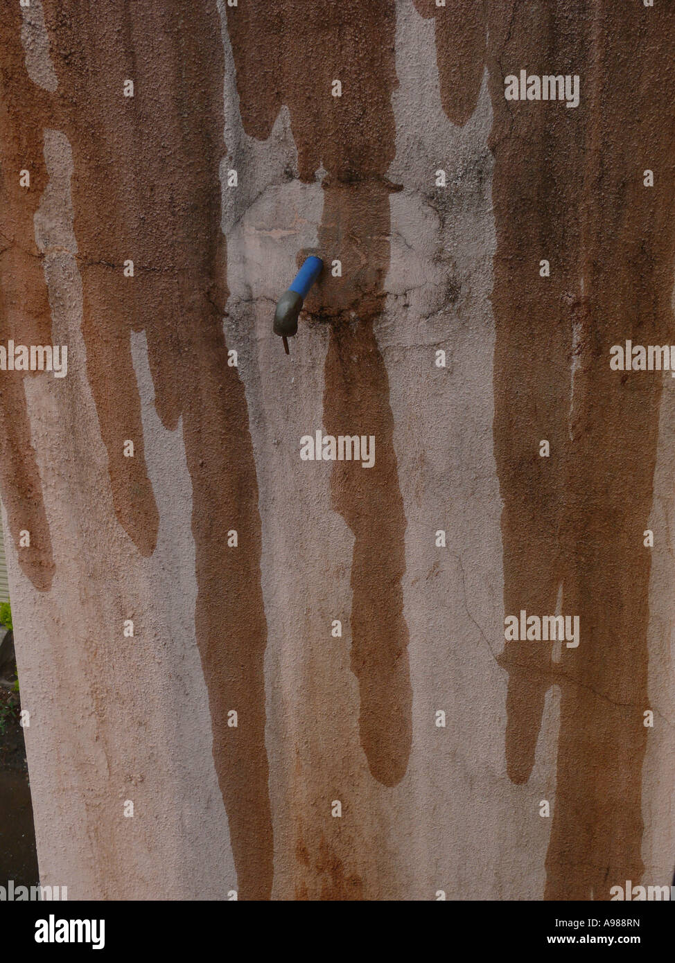 Rain water waste away and a plastic pipe fixed on parapet wall for ...