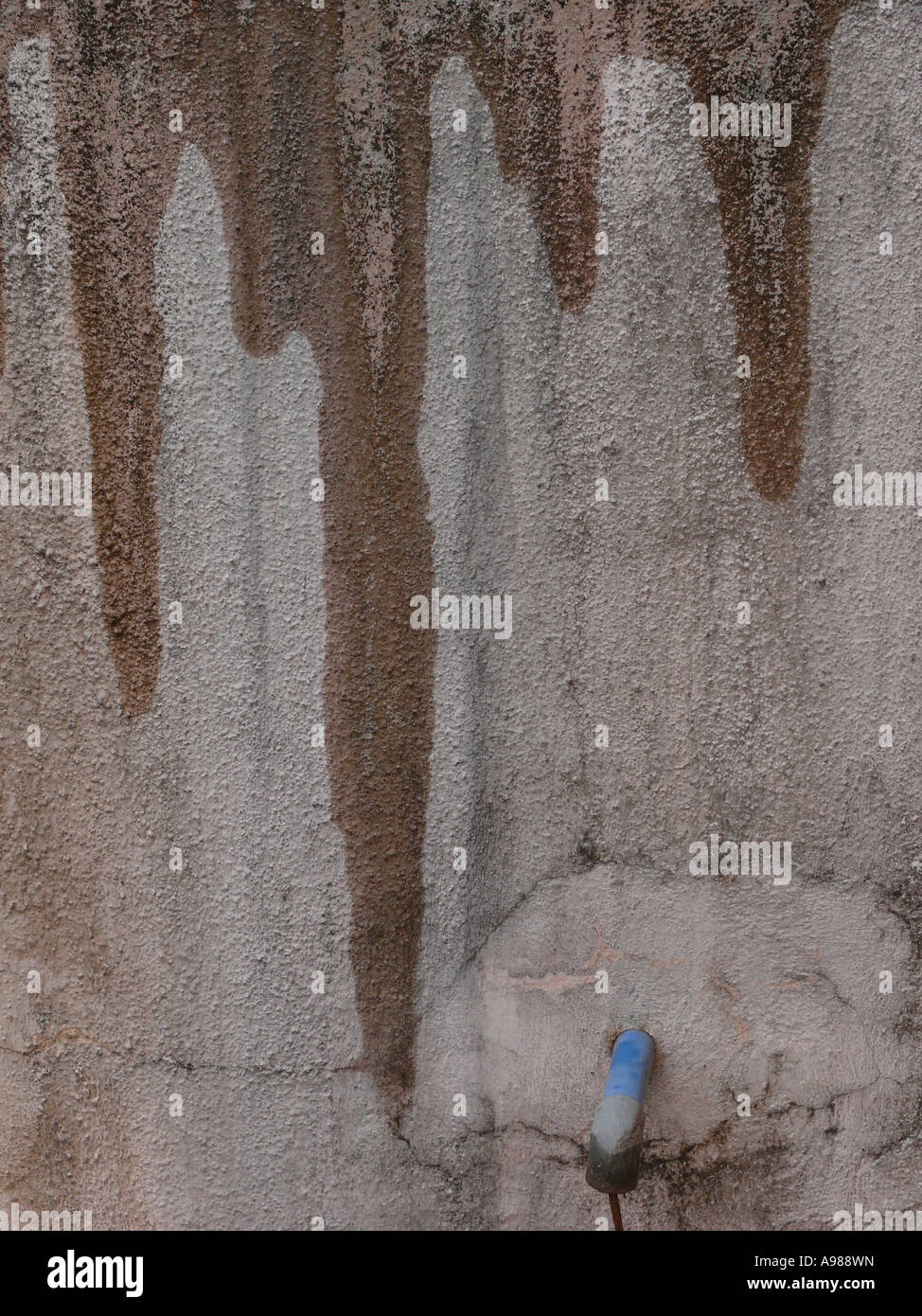 Rain water waste away and a plastic pipe fixed on parapet wall for ...