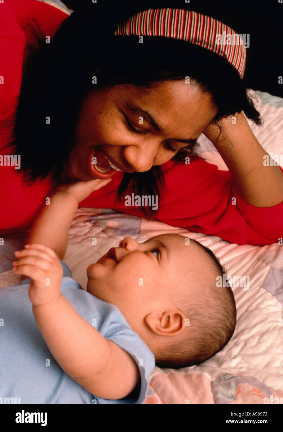 Mother interacting with 5 month old baby Stock Photo - Alamy