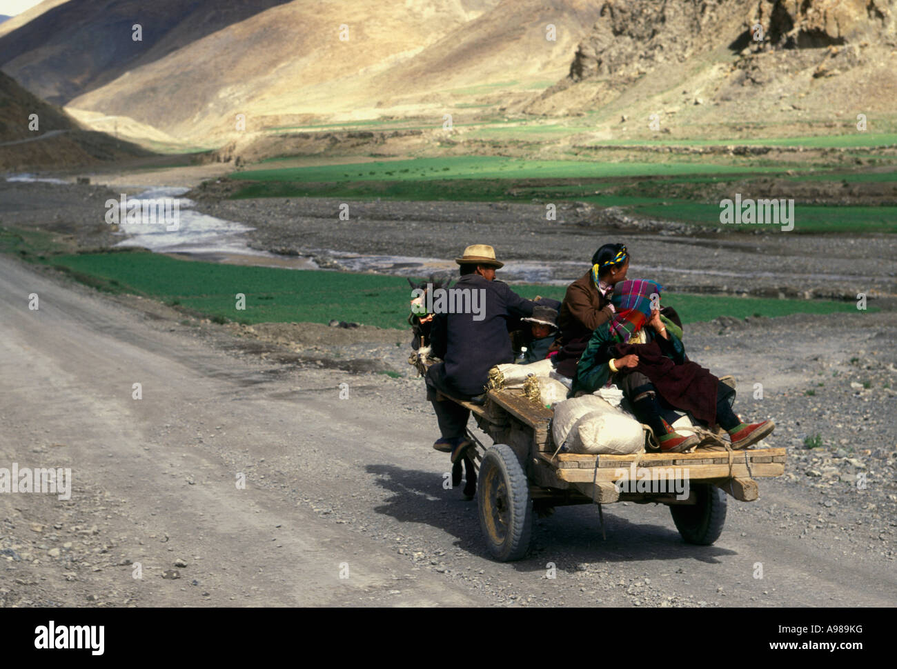 Tibetans, Tibetan family, man, woman, children, horse-drawn carriage ...