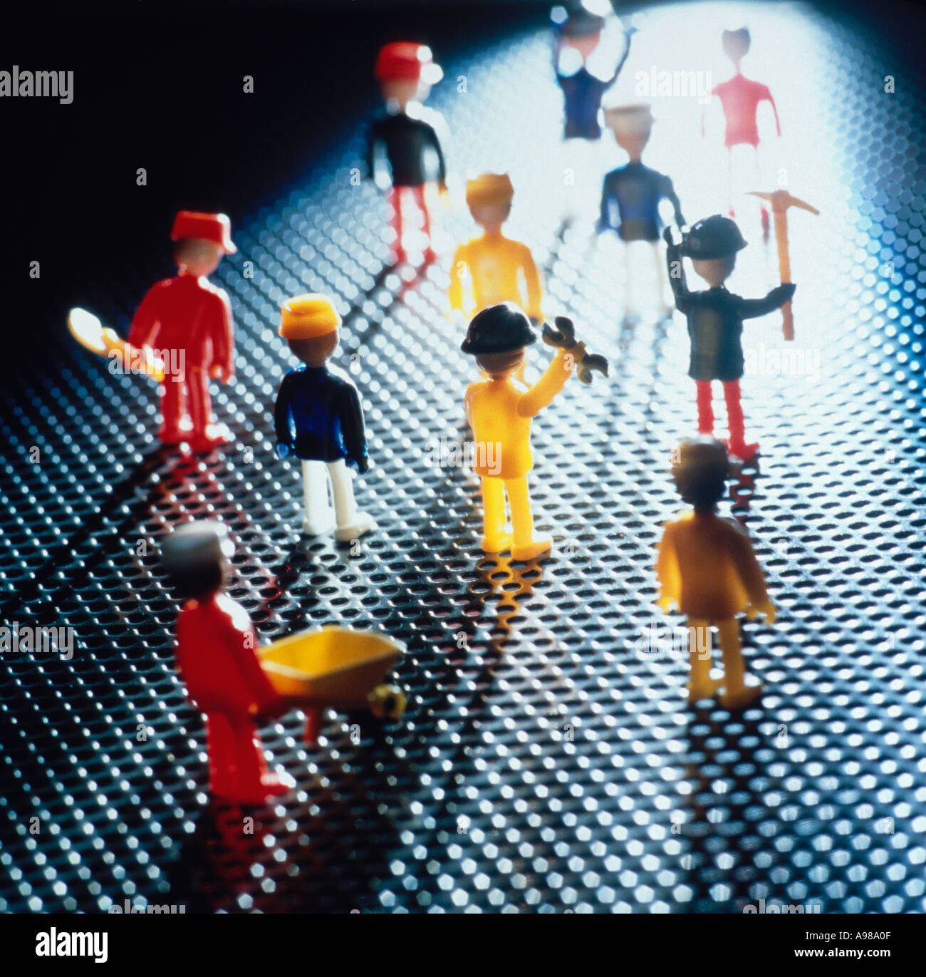 Figures of construction workers assembled together looking toward a ...