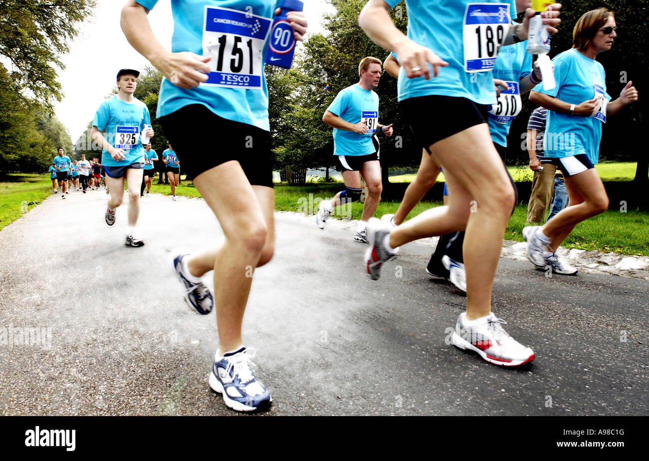 runners take part in a charity run in aid of cancer research Stock ...