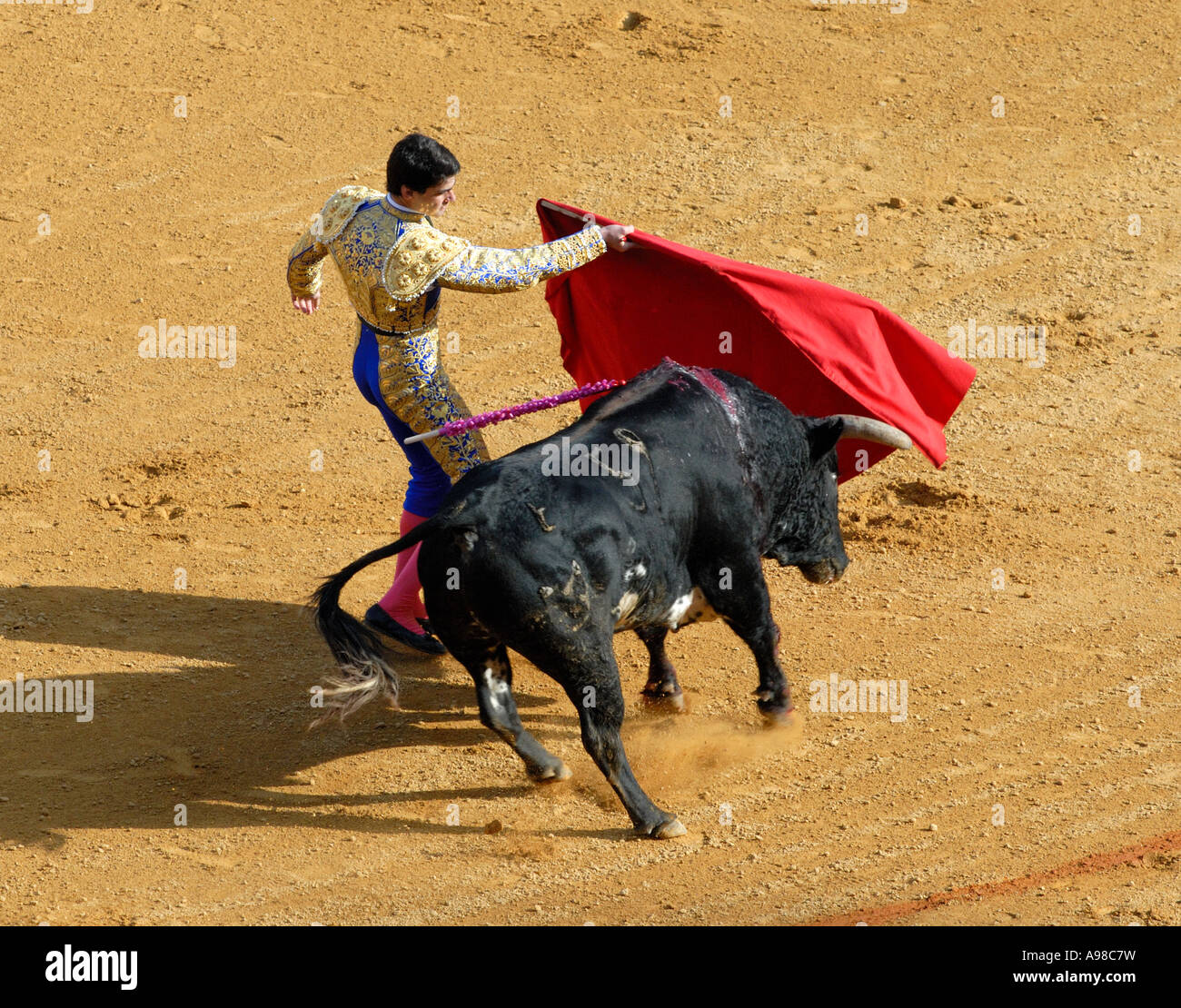Bullfighter holding red cape bull hi-res stock photography and images ...