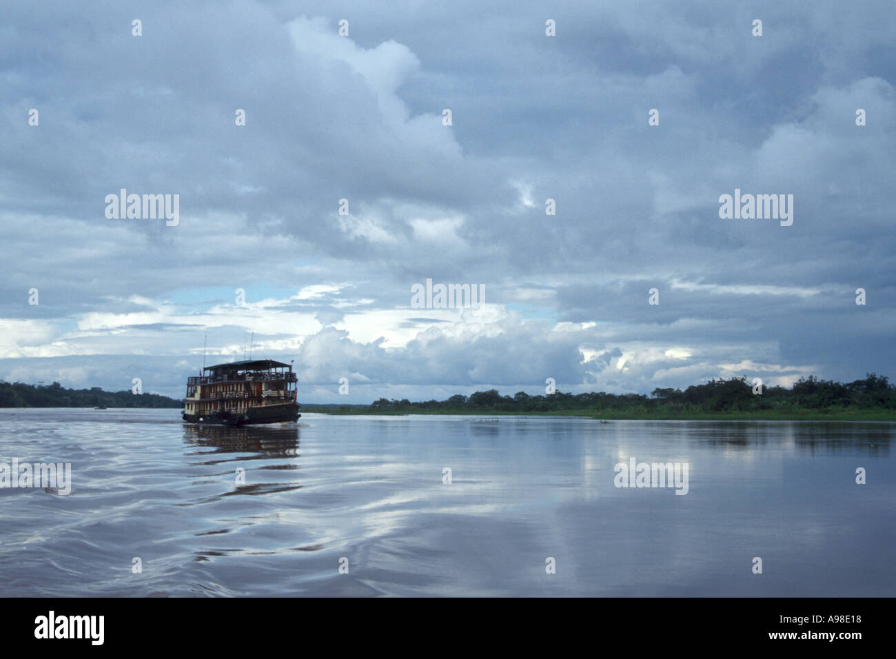 River Boat on the Silky Waters of the Amazon River Peru Stock Photo - Alamy