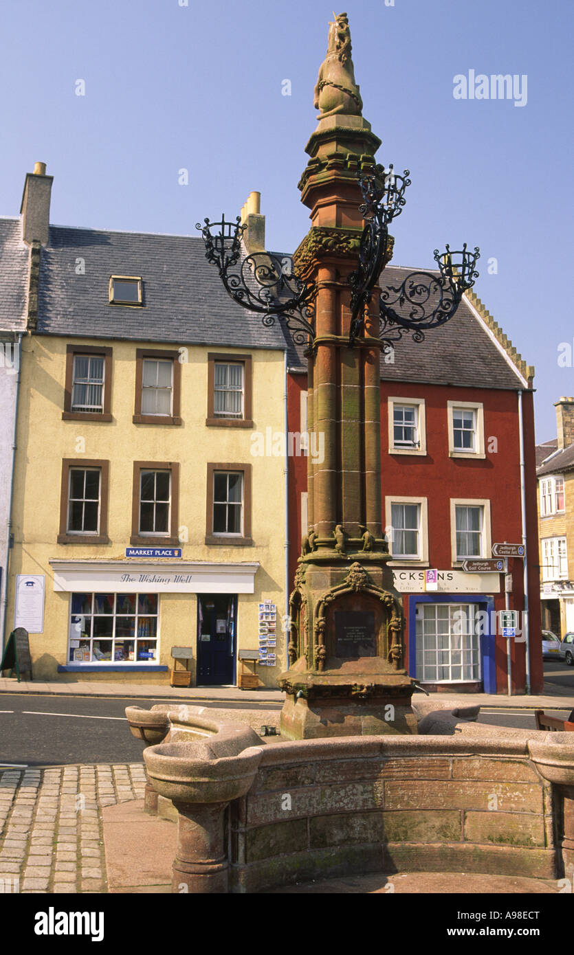 Old houses and Mercat Cross in Jedburgh town centre and shops on Market ...