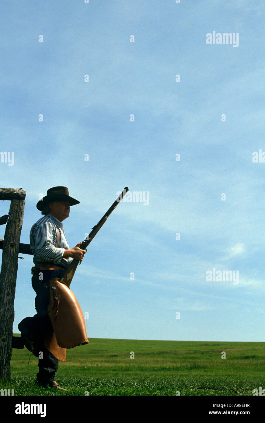 COWBOY STANDS GUARD AT ROCK CREEK STATION STATE HISTORICAL PARK ALONG ...