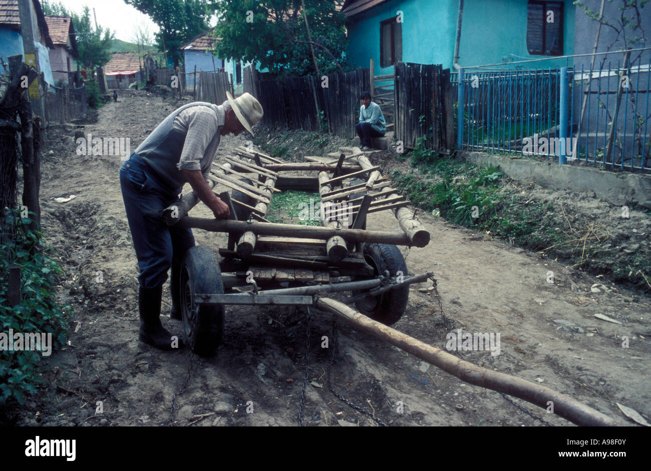 A farmer gets a wagon ready for passengers in the Gypsy village of ...