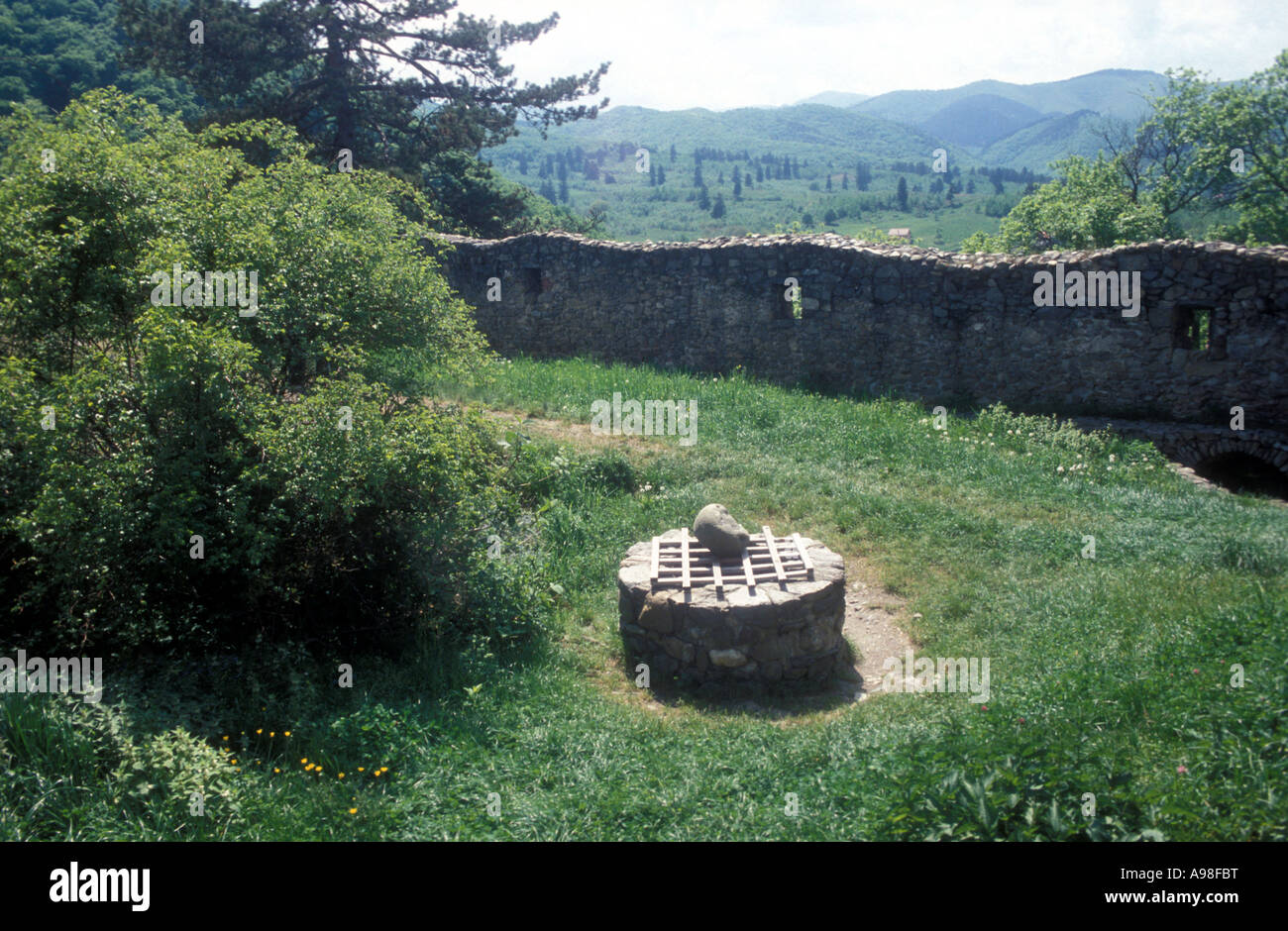 Saxon fortified church, well, stone wall, and surrounding landscape.at ...