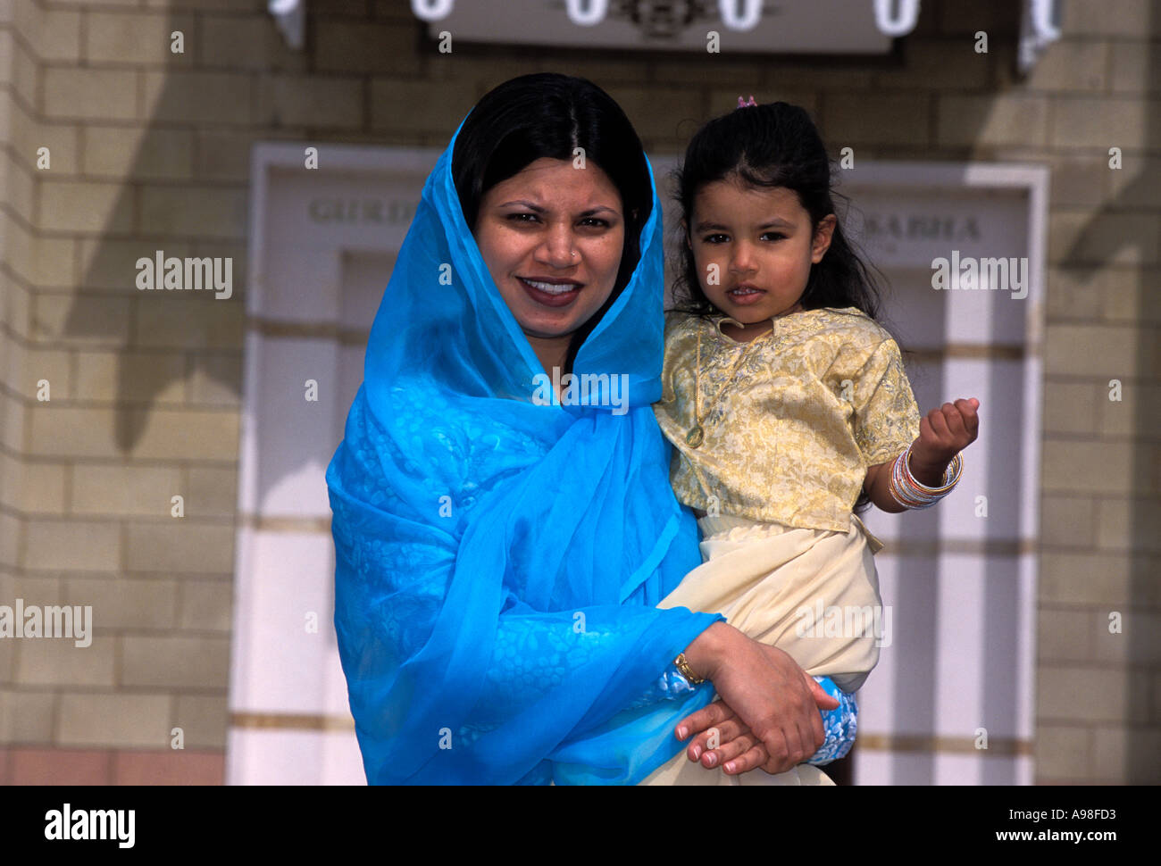 Sikh mother and daughter outside Gurdwara temple London England Stock ...
