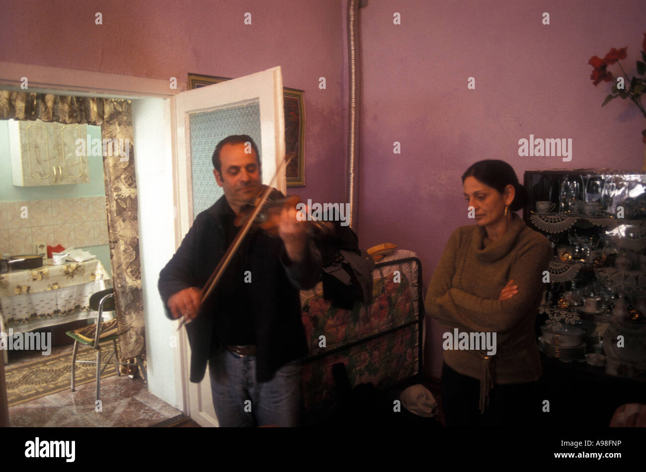 A Gypsy violinist plays at his home in Sighisoara, Romania while his ...
