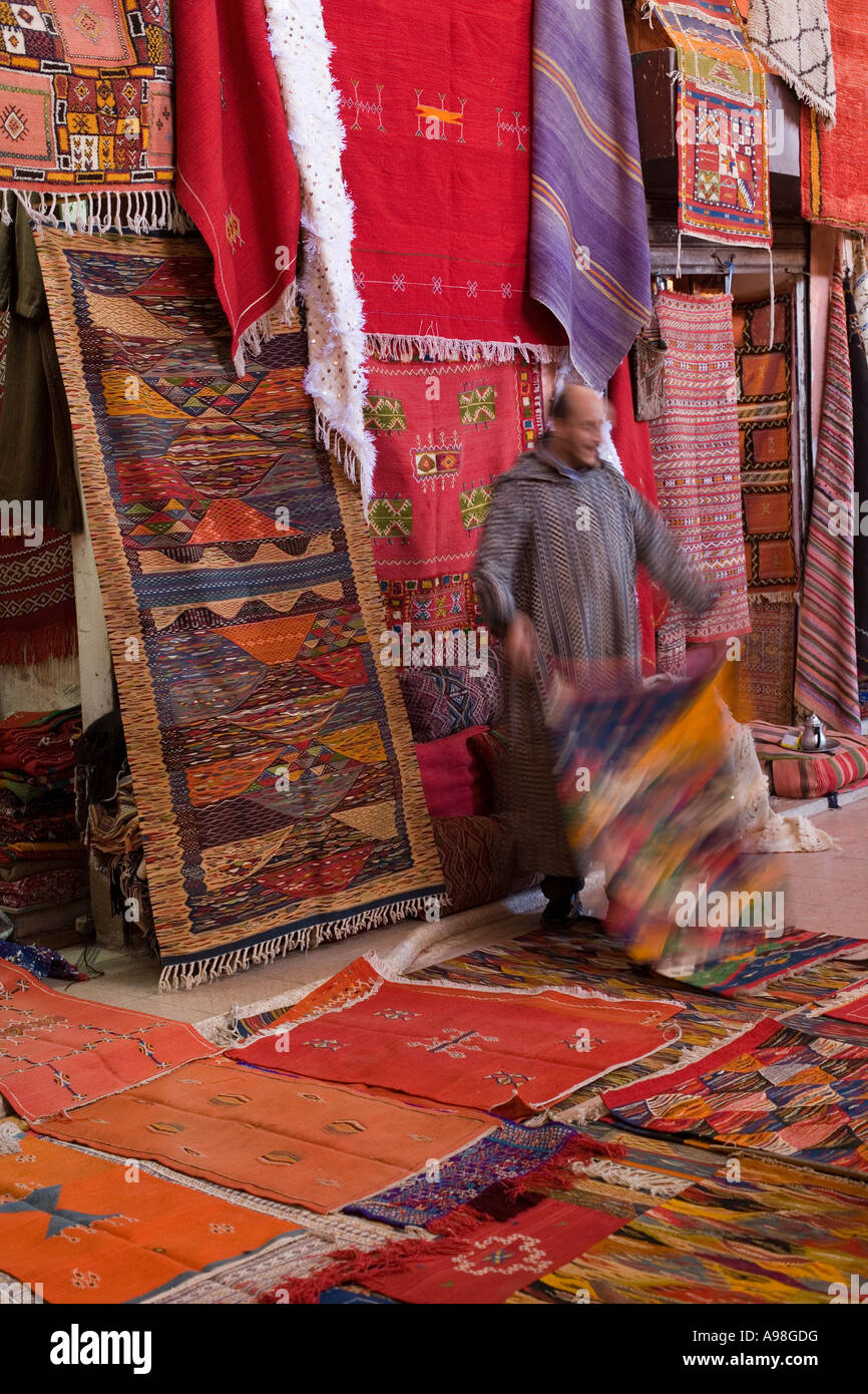 Morocco, Marrakesh, man selling carpet Stock Photo - Alamy