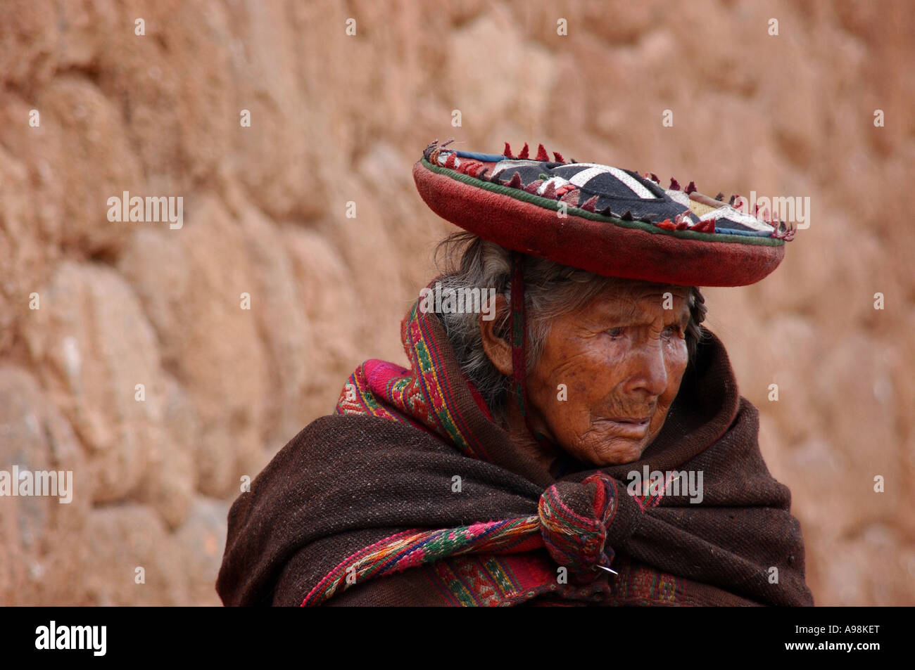 An old Peruvian woman wearing traditional Peruvian costume stands in ...