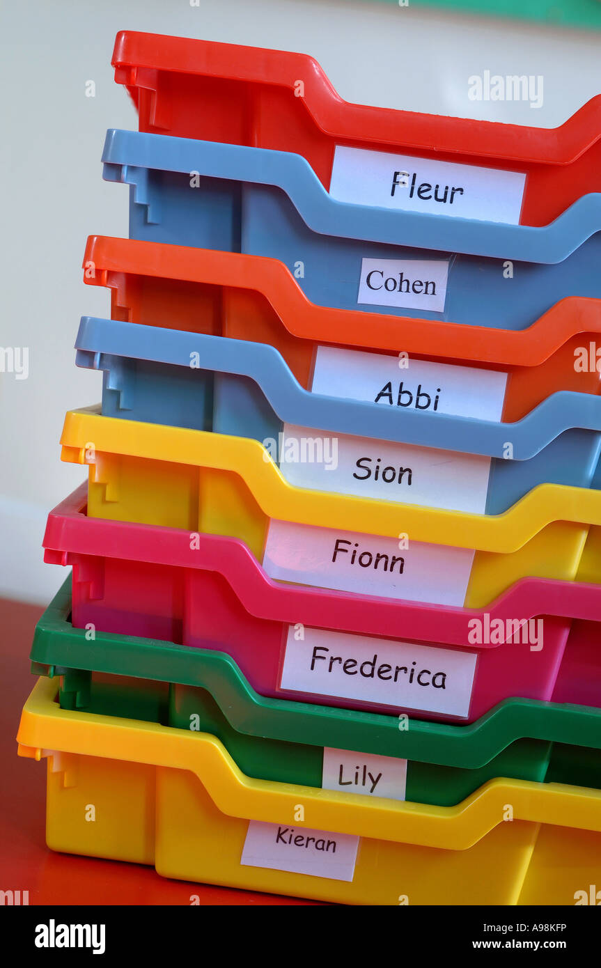 Childrens names on a stack of trays at a nursery Stock Photo - Alamy