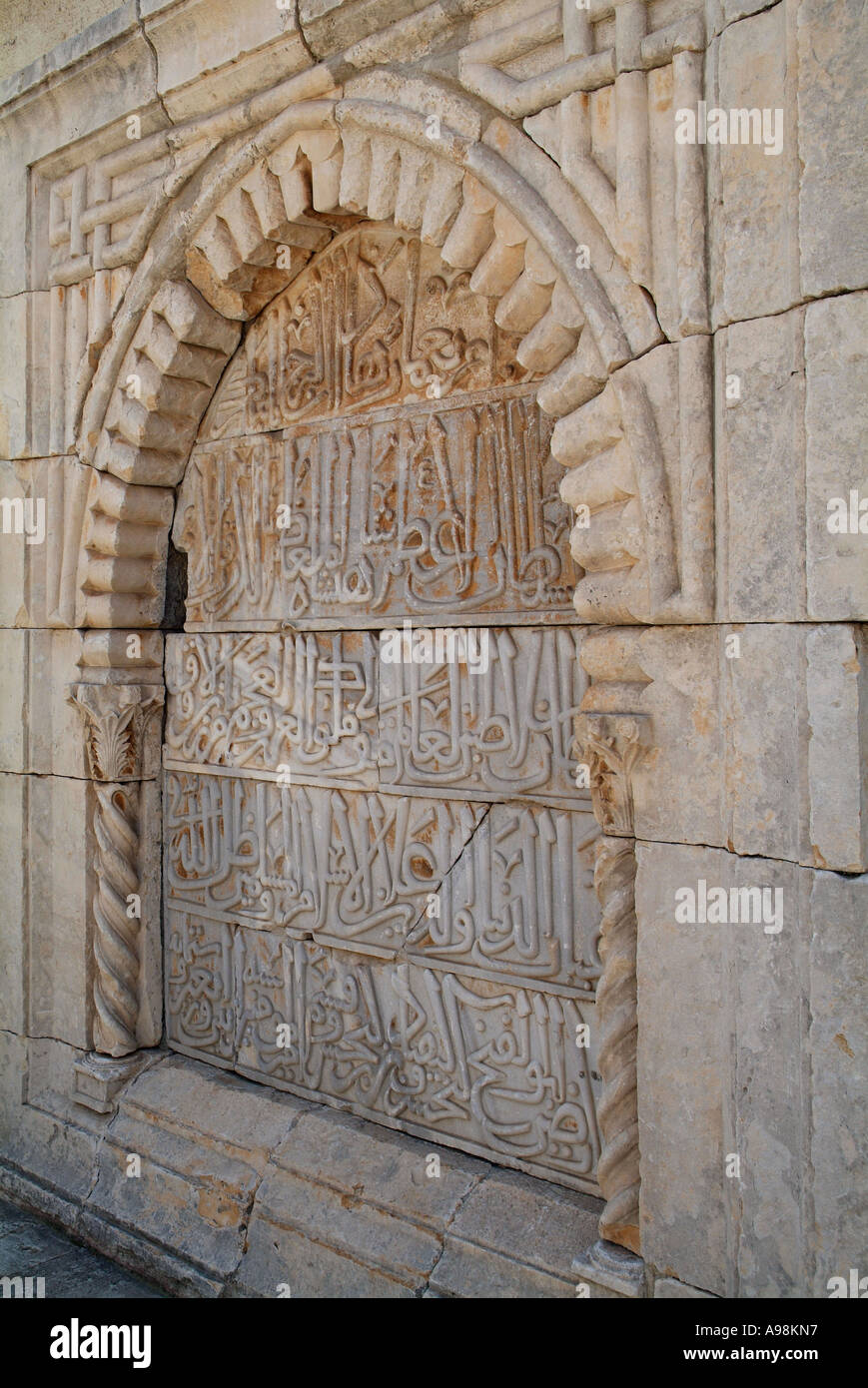 Carved Arabic inscriptions and masonry arch in a stone wall Antalya ...