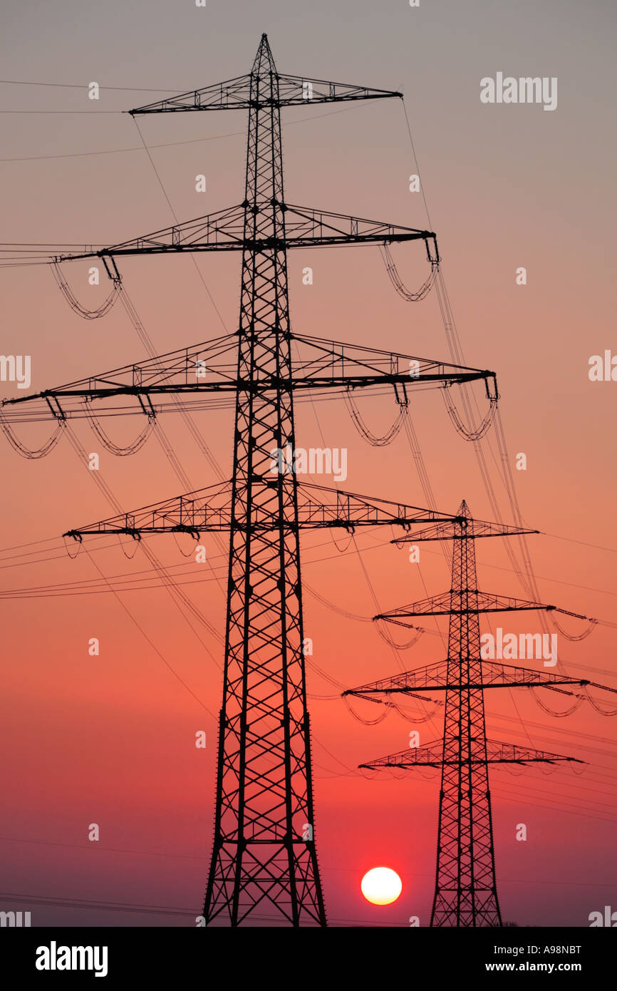 pylons in front of the setting sun Stock Photo - Alamy