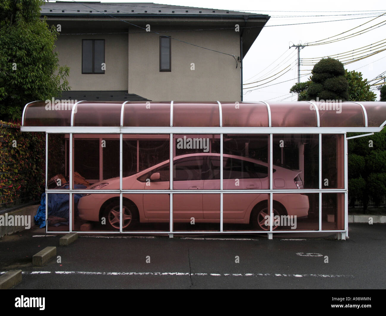 Outdoor transparent car garage in Japan Stock Photo - Alamy