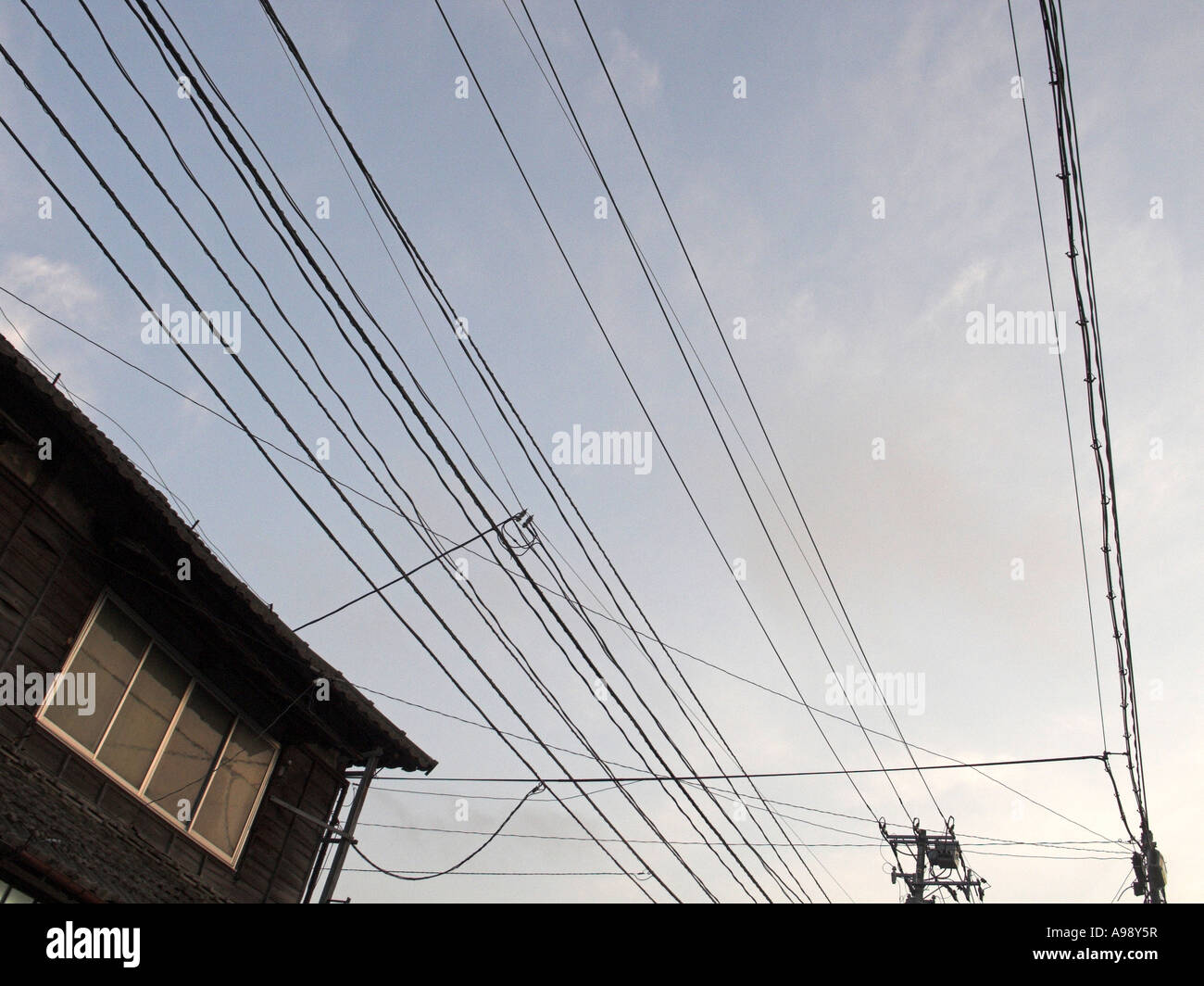 Traditional house and Japanese typical electric wires Stock Photo - Alamy