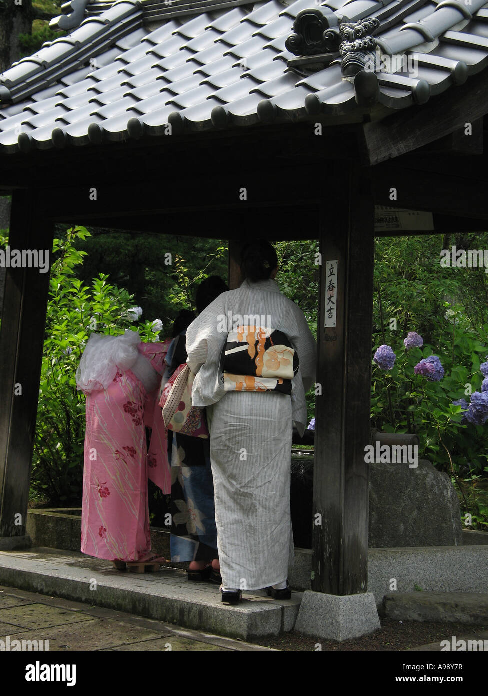 Women in kimono inside the temple Stock Photo - Alamy