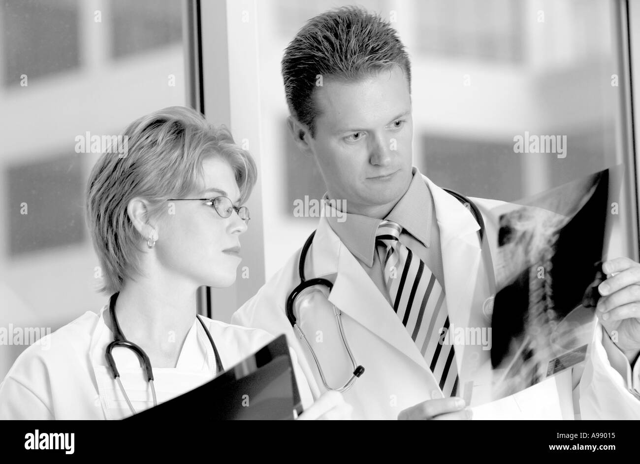 Healthcare professionals with patient Black and White Stock Photos ...