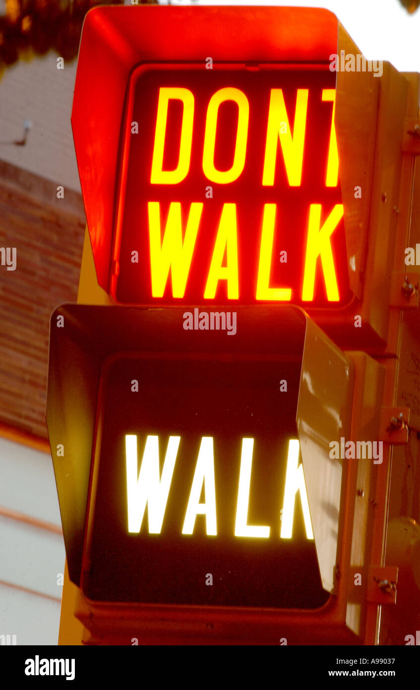 Vertical color image of a street crossing sign showing both walk and ...