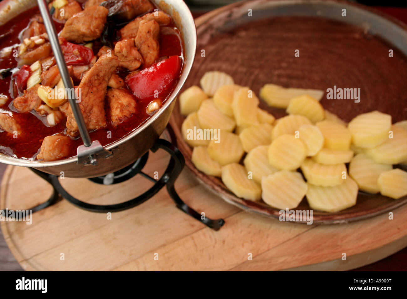 Delicious Hungarian goulash served in a traditional pot with sliced ...
