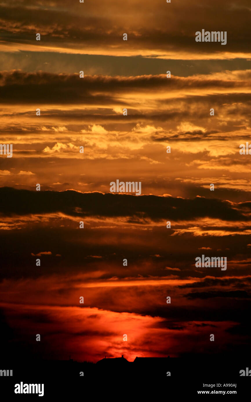 Vibrant sunset sky filled with dramatic clouds, creating a mesmerizing ...