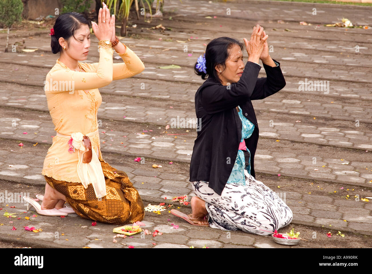 Balinese ladies praying Bali Indonesia Stock Photo - Alamy