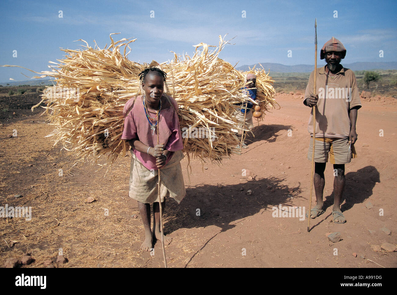 Woman Carrying Heavy Load