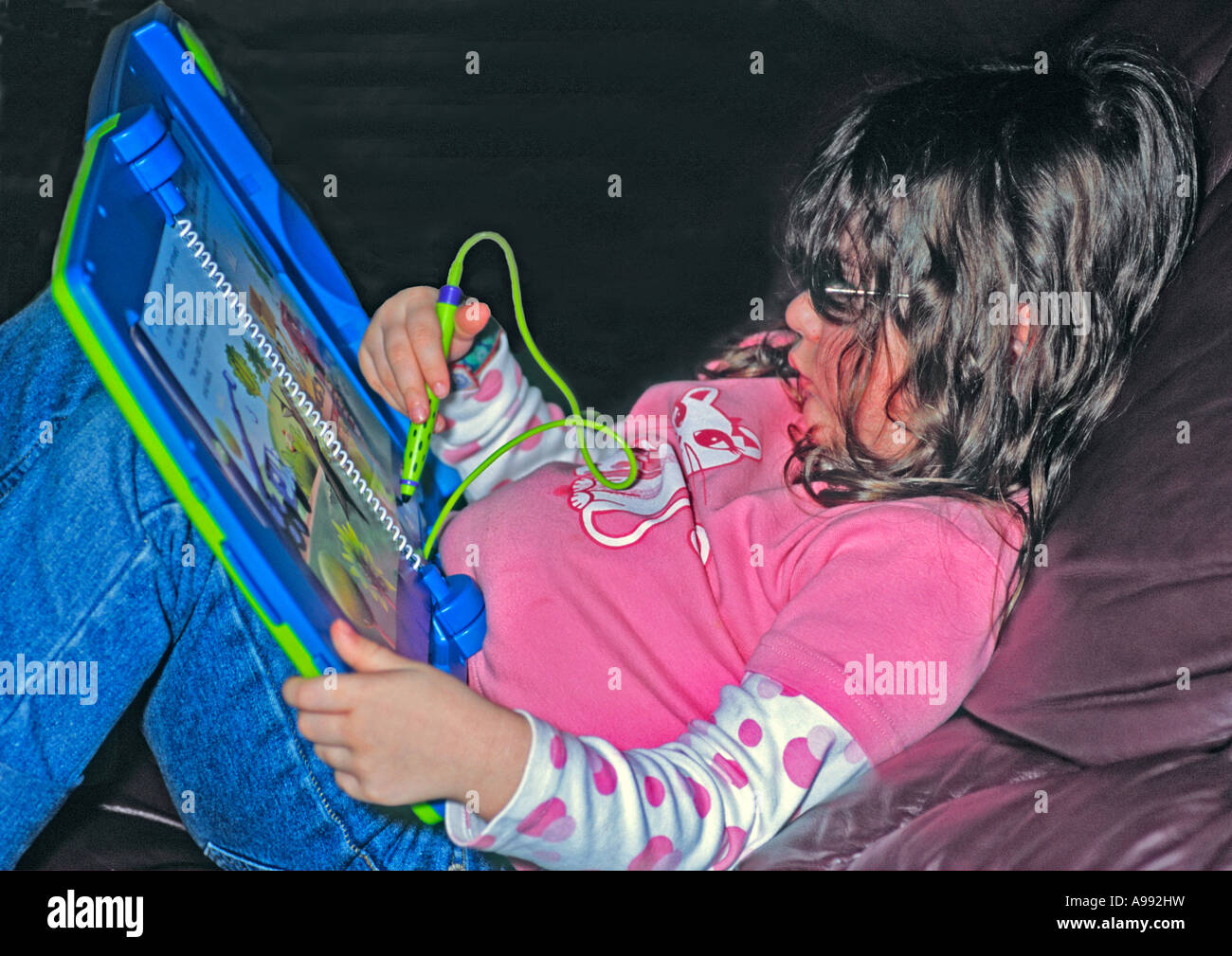 Child with a computer hi-res stock photography and images - Alamy
