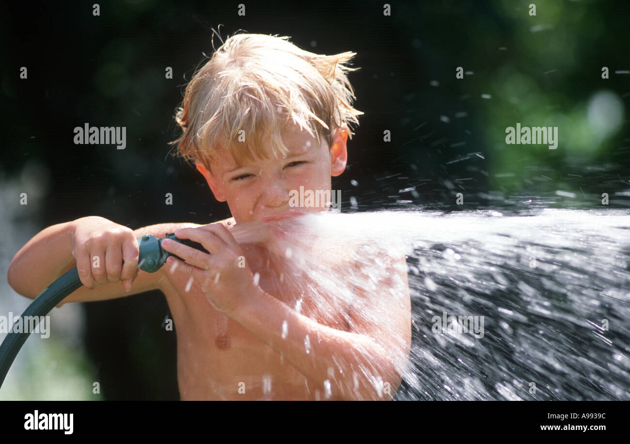 Boy getting wet hi-res stock photography and images - Alamy
