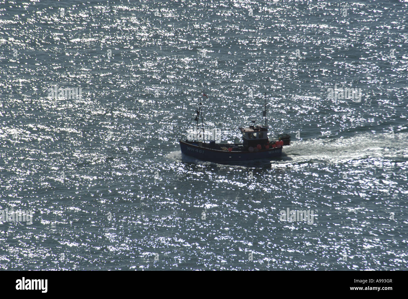 A small inshore fishing boat off Bolt Head on its way to Salcome ...