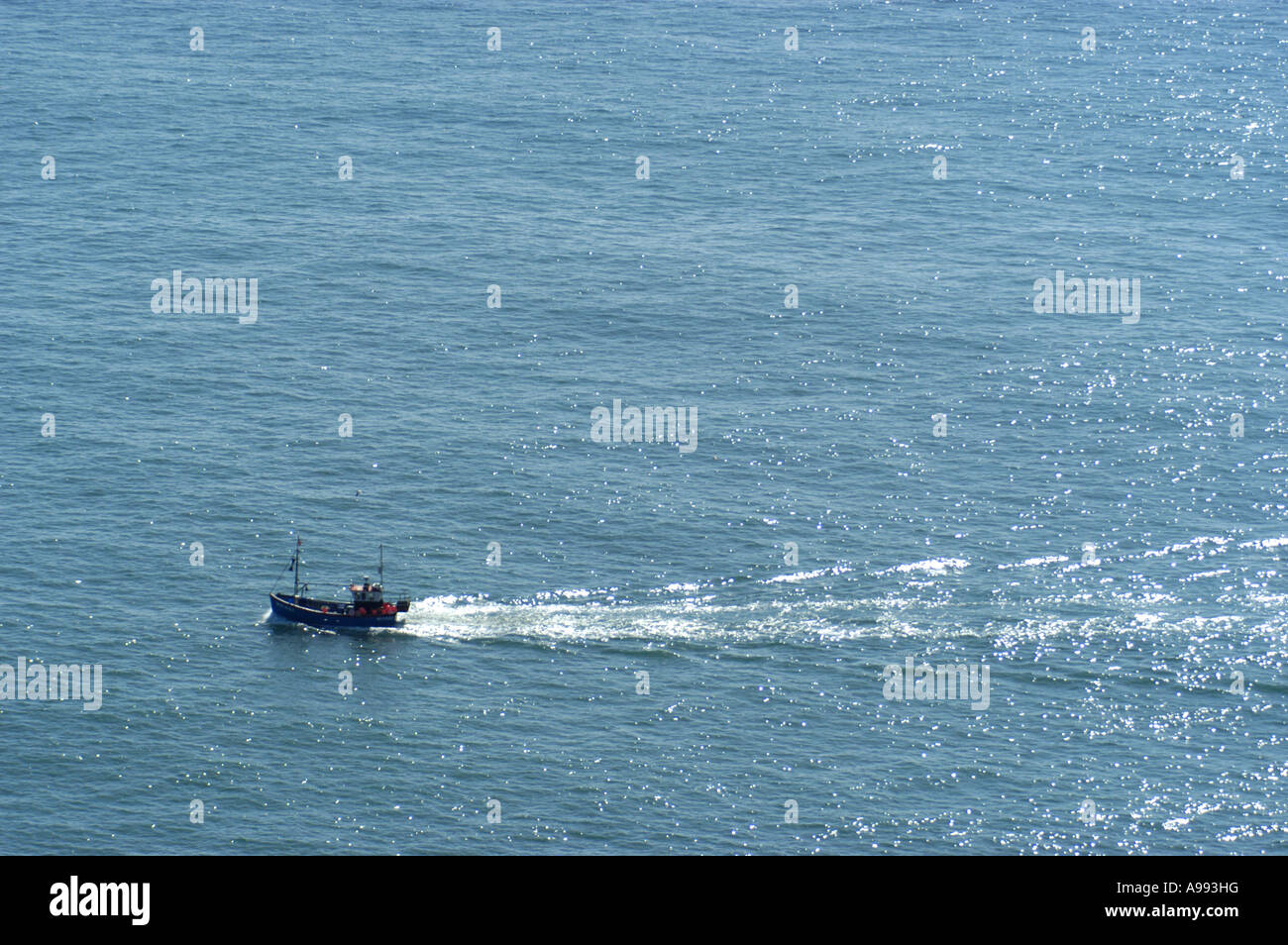 A small inshore fishing boat off Bolt Head on its way to Salcome ...