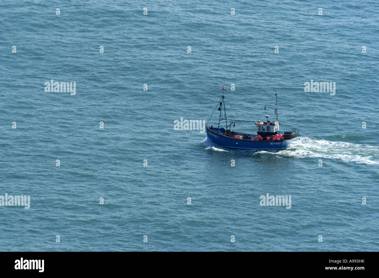 A small inshore fishing boat off Bolt Head on its way to Salcome ...