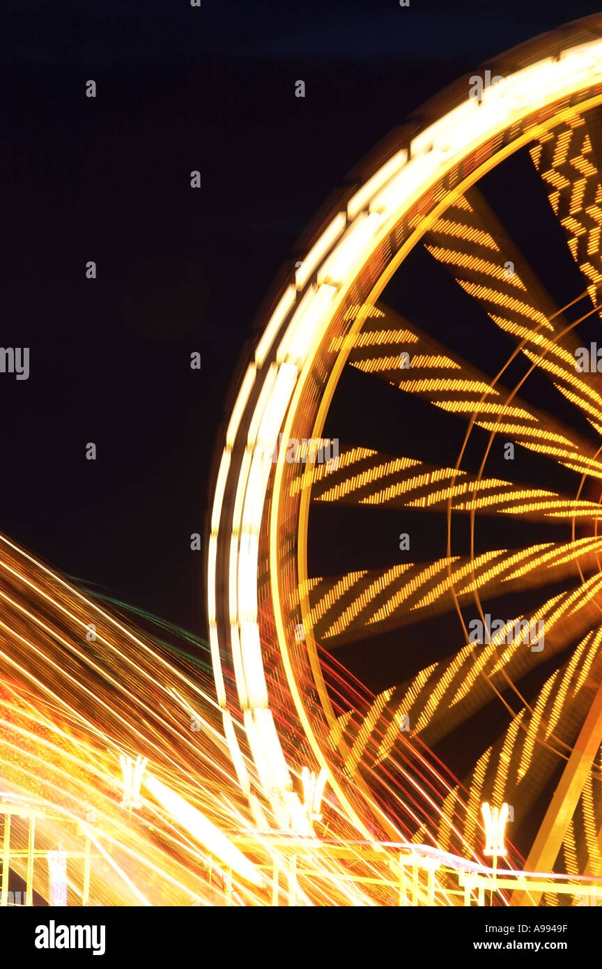 Ferris wheel in movement on a public festival Stock Photo - Alamy
