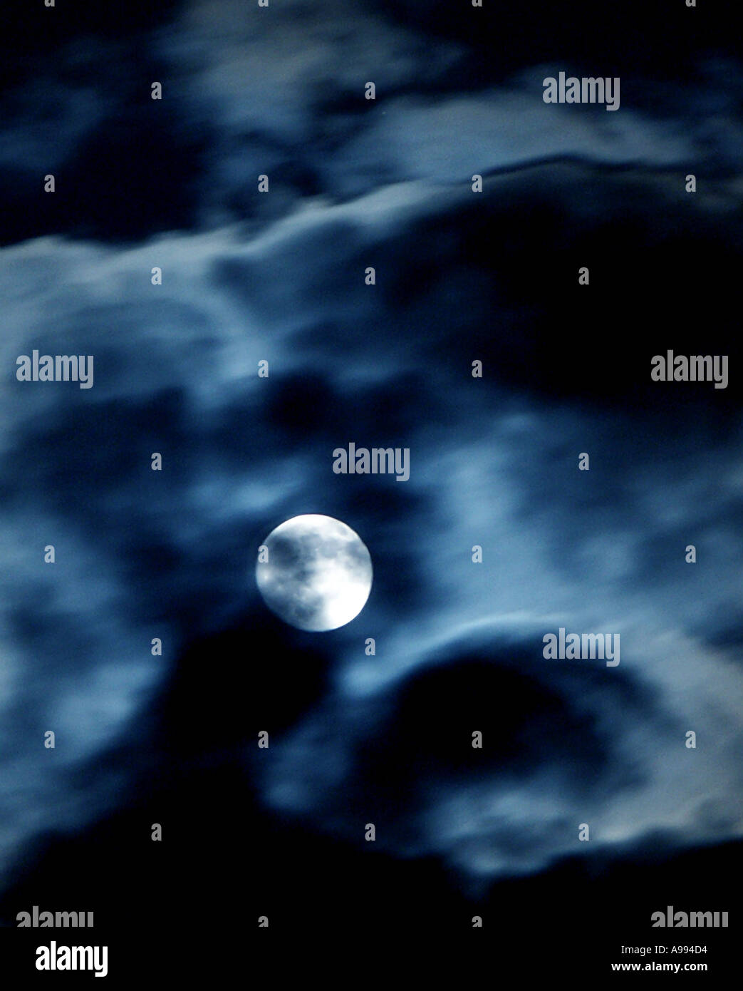 Moon behind clouds hi-res stock photography and images - Alamy