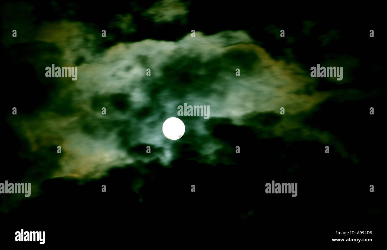 Moon behind clouds hi-res stock photography and images - Alamy